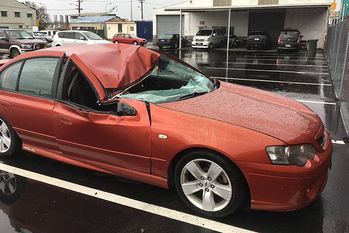 SunLive - Car crushed by toppled container - The Bay's News First